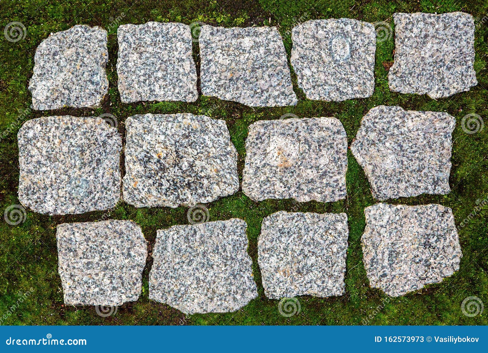 Granite Paving Stones on a Green Field Stock Image - Image of granite ...