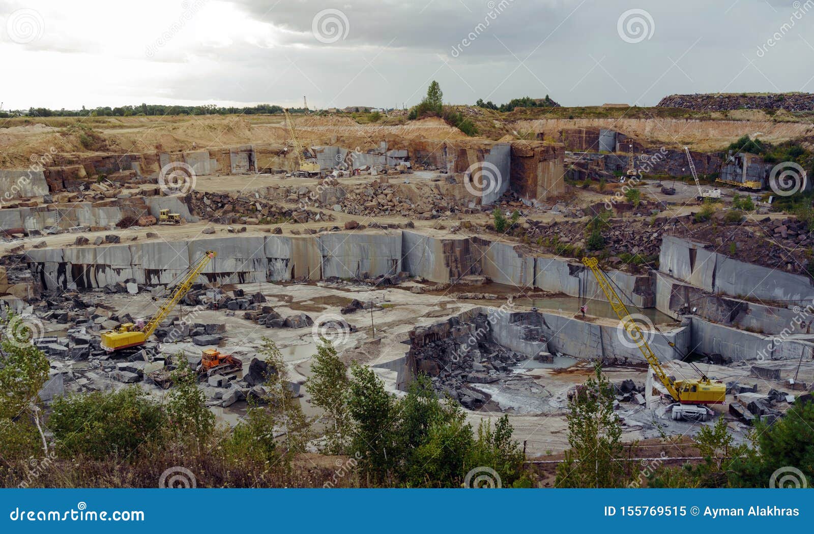 Granite Stone Mine with Heavy Equipment Excavators Loading Raw Rocks ...