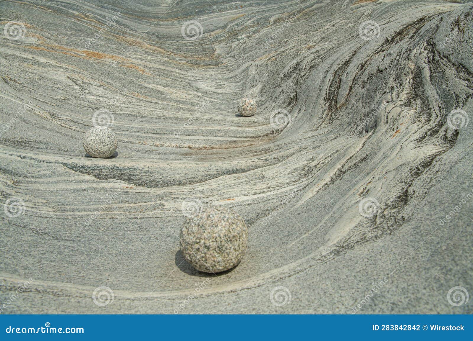Granite Stone Waves As Background with Three Round Stones Stock Photo ...