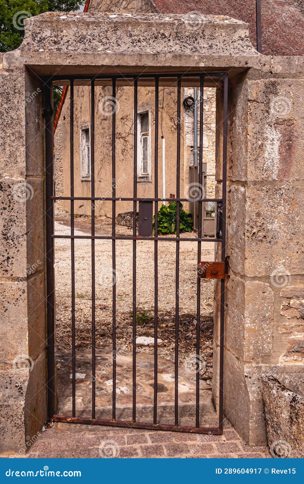 Granite Wall and Entry with Iron Barred Gate Stock Image - Image of ...