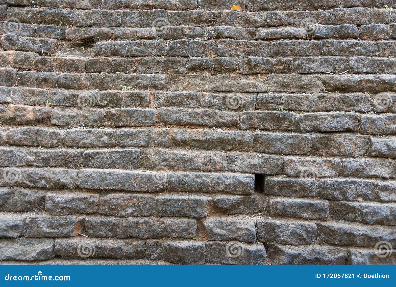 Granite Wall Made Up of Layers of Slabs Fixed in Place with Rough ...