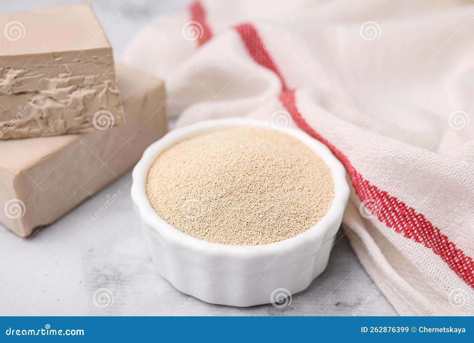 Granulated and Compressed Yeast on White Marble Table, Closeup Stock ...