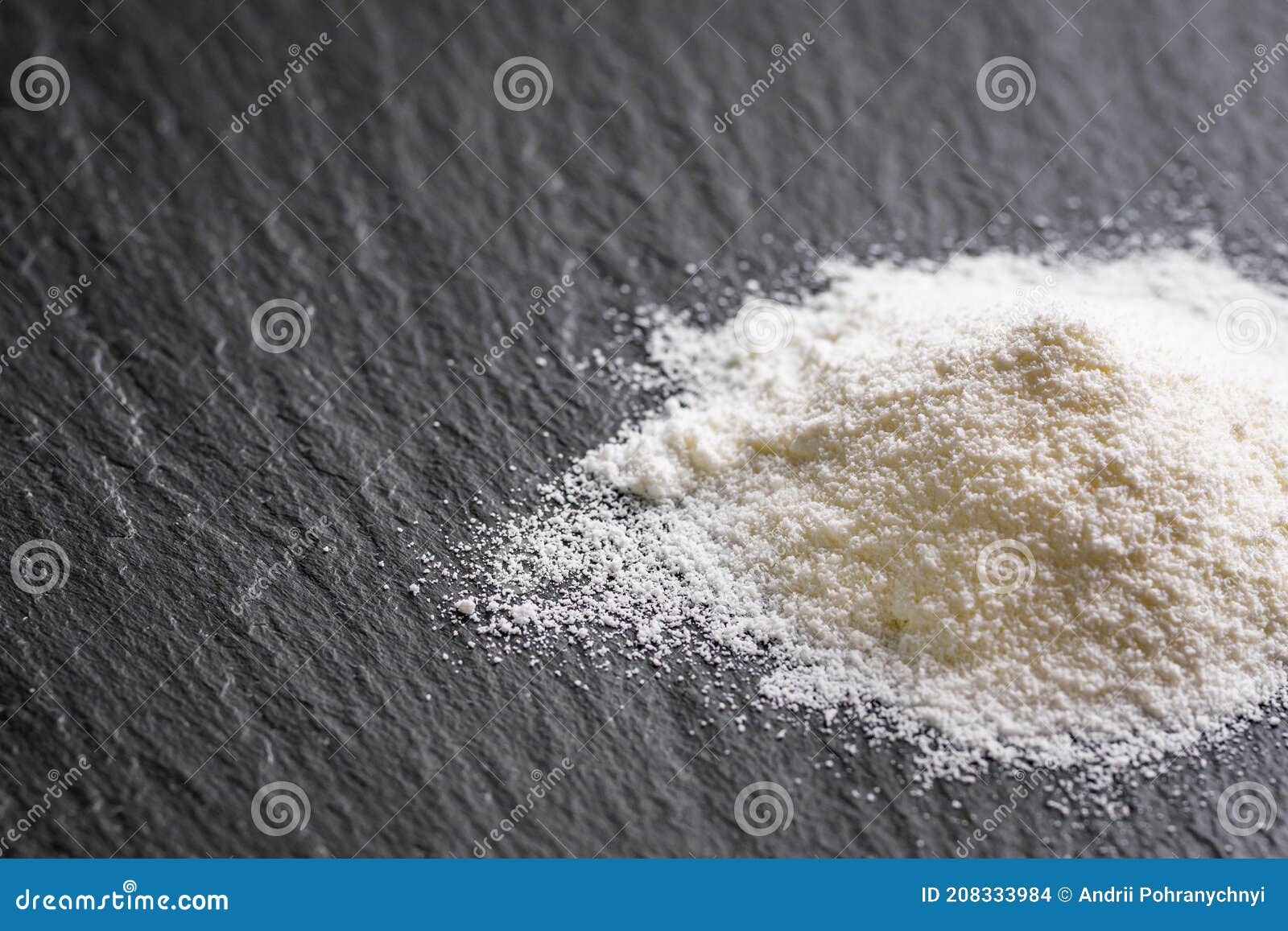 Granulated Milk Powder on a Dark Stone Background Stock Photo - Image ...