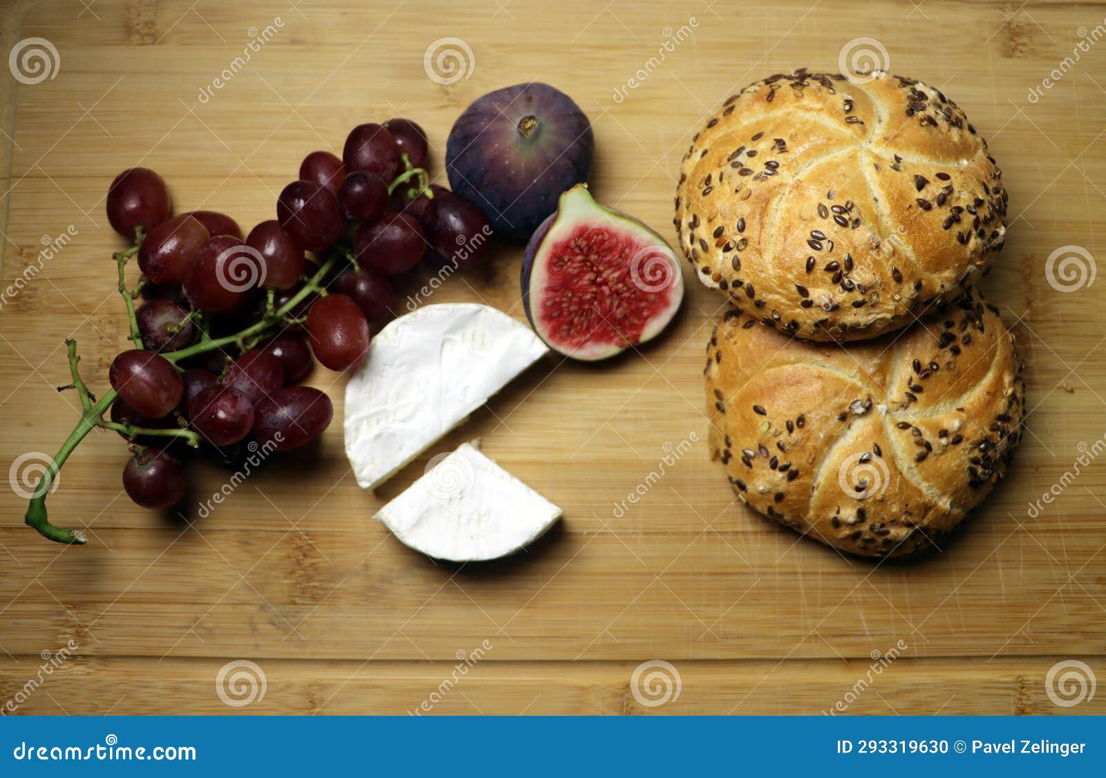 Grape, Fig, Cheese and Bun on Kitchen Breadboard Stock Photo - Image of ...