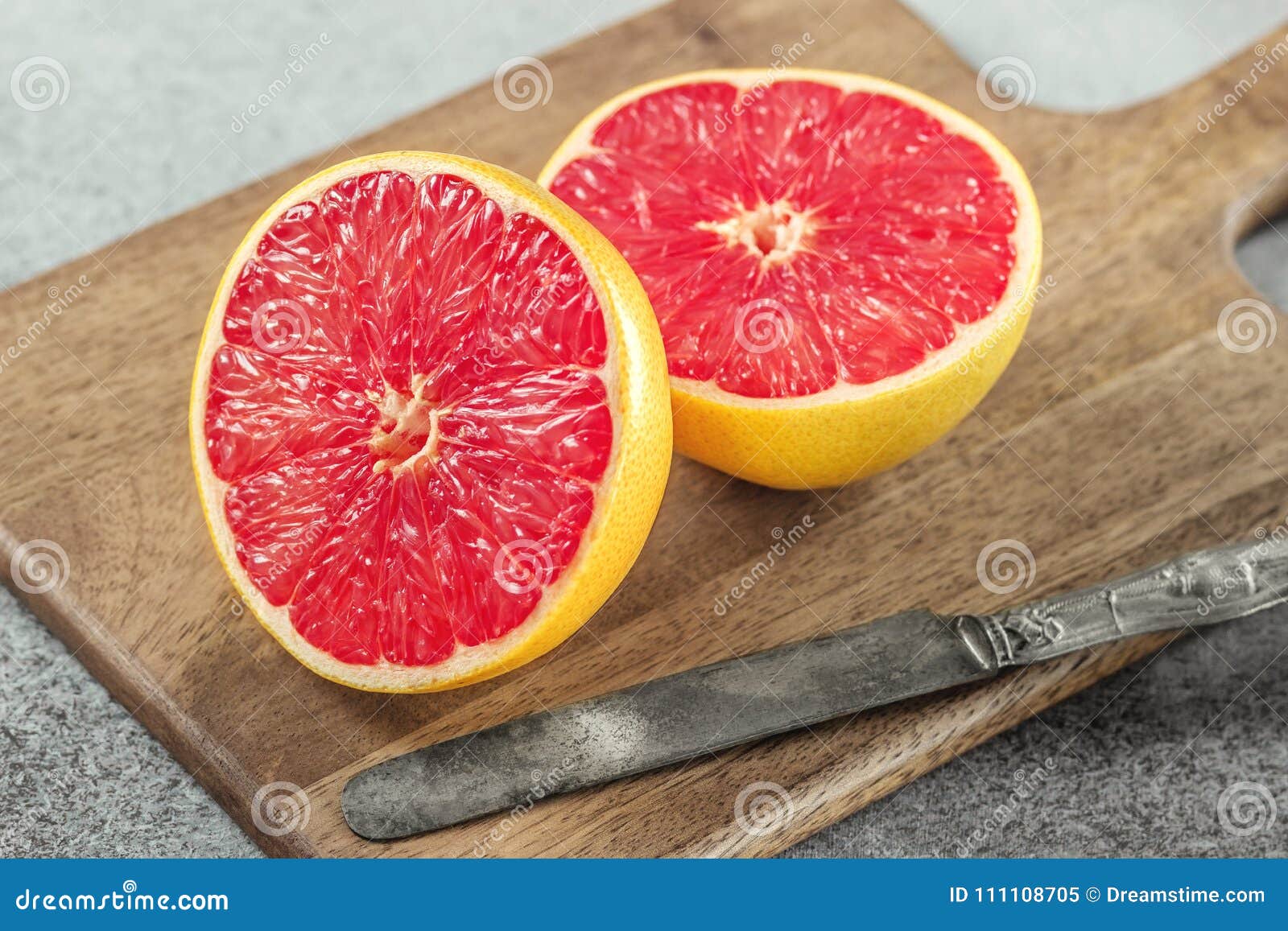 Grapefruit Citrus Fruit Halves on Cutting Board Stock Image - Image of ...