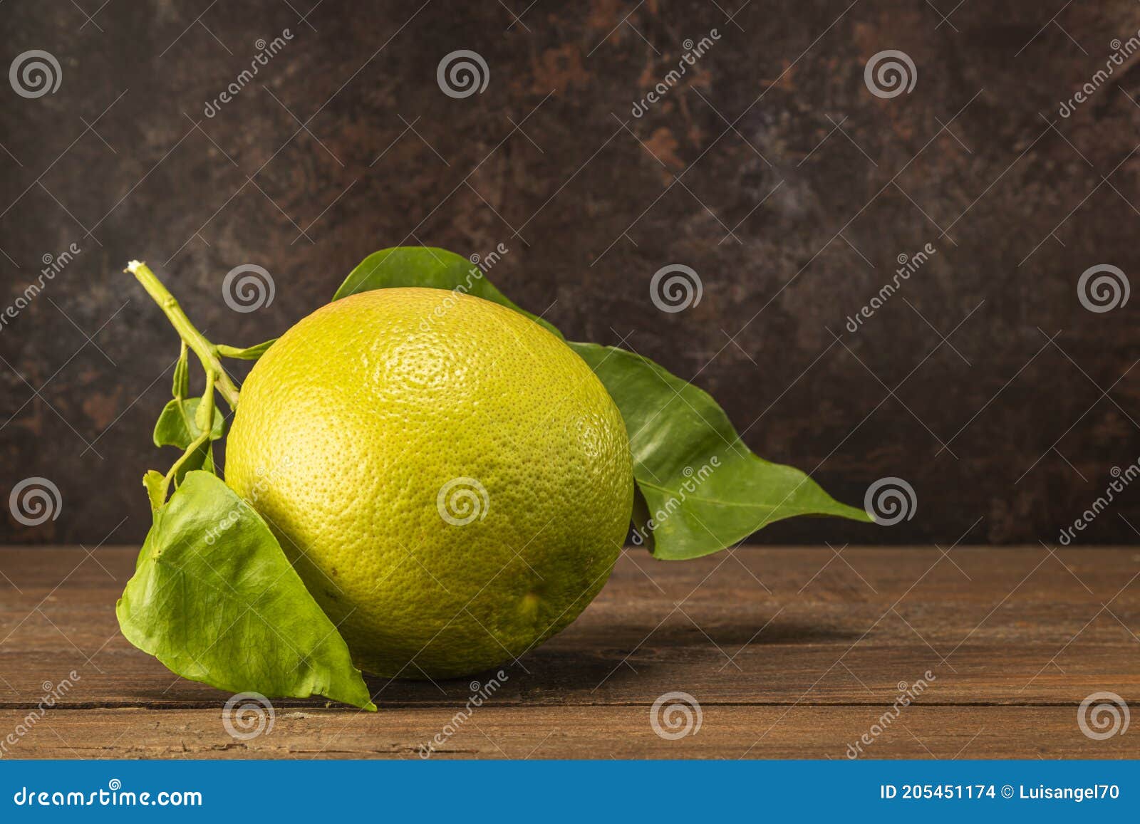 Grapefruit with Leaves on a Wooden Table 2 Stock Photo - Image of juicy ...