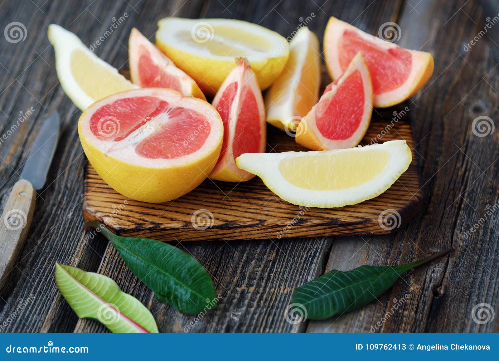 Grapefruit and Lemon Cut Slices on Grey Background Stock Image - Image ...