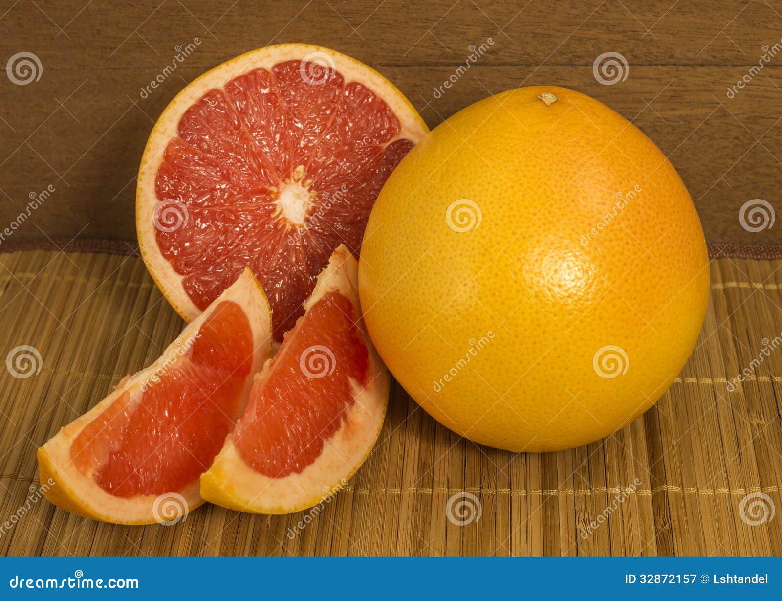 Grapefruit. Whole Fruit and Slices are on the Table Stock Image - Image ...