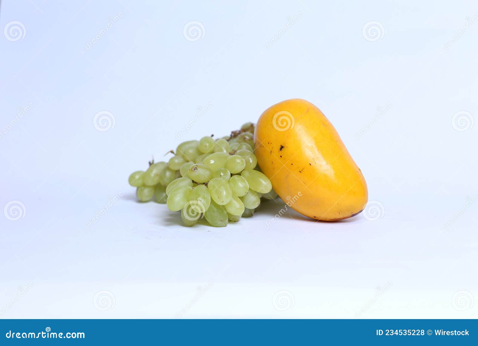Grapes and a Mango Isolated on White Background Stock Photo - Image of ...