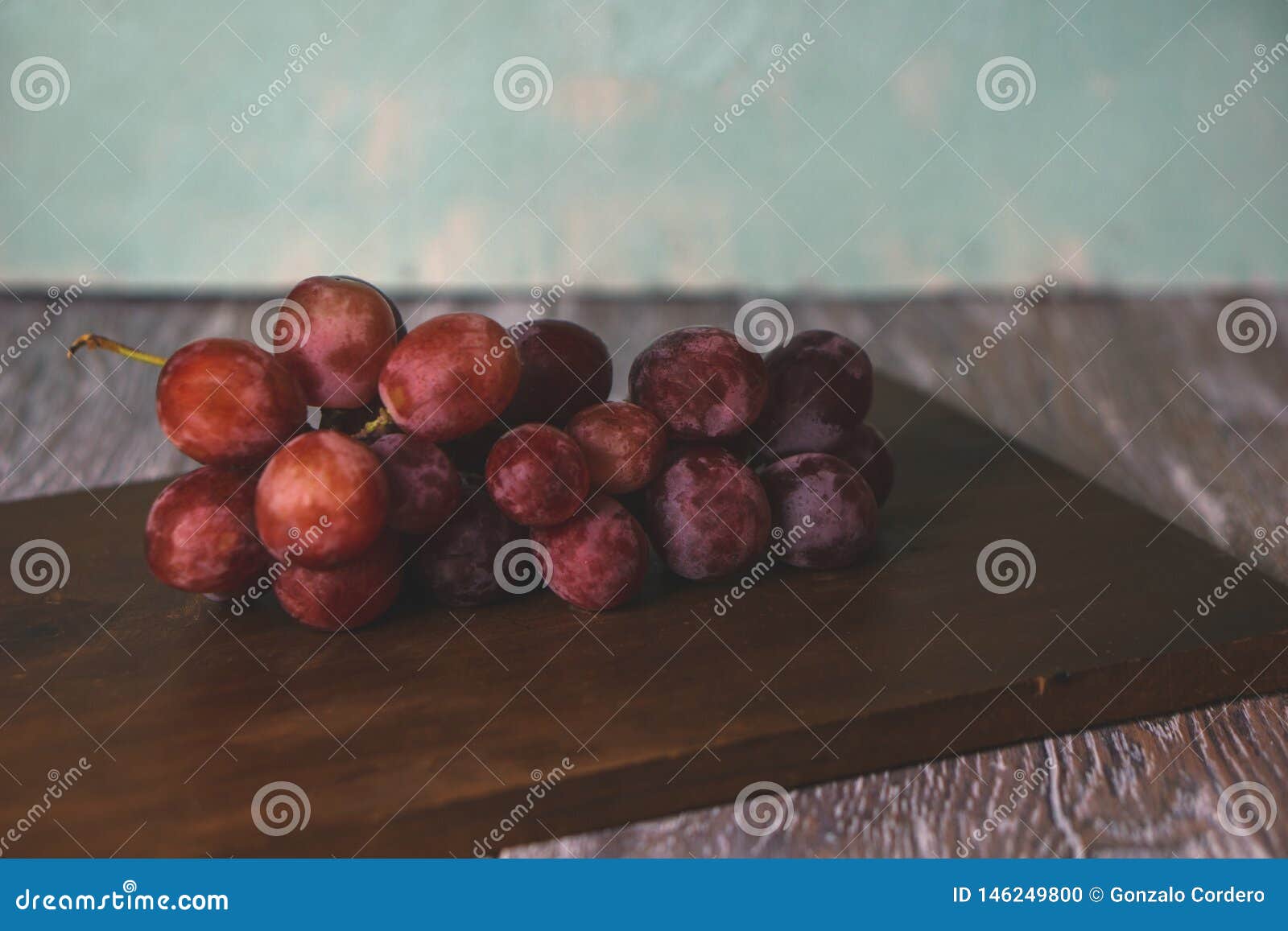 Fresh grapes on table stock photo. Image of summertime - 146249800