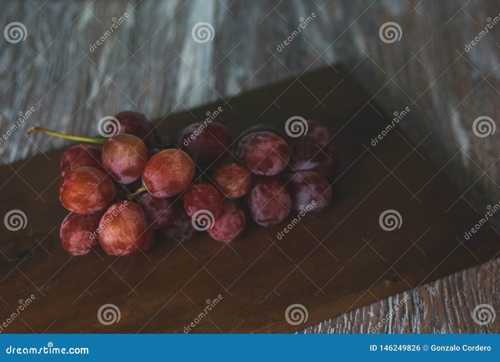 Grapes on table stock photo. Image of dessert, grapes - 146249826