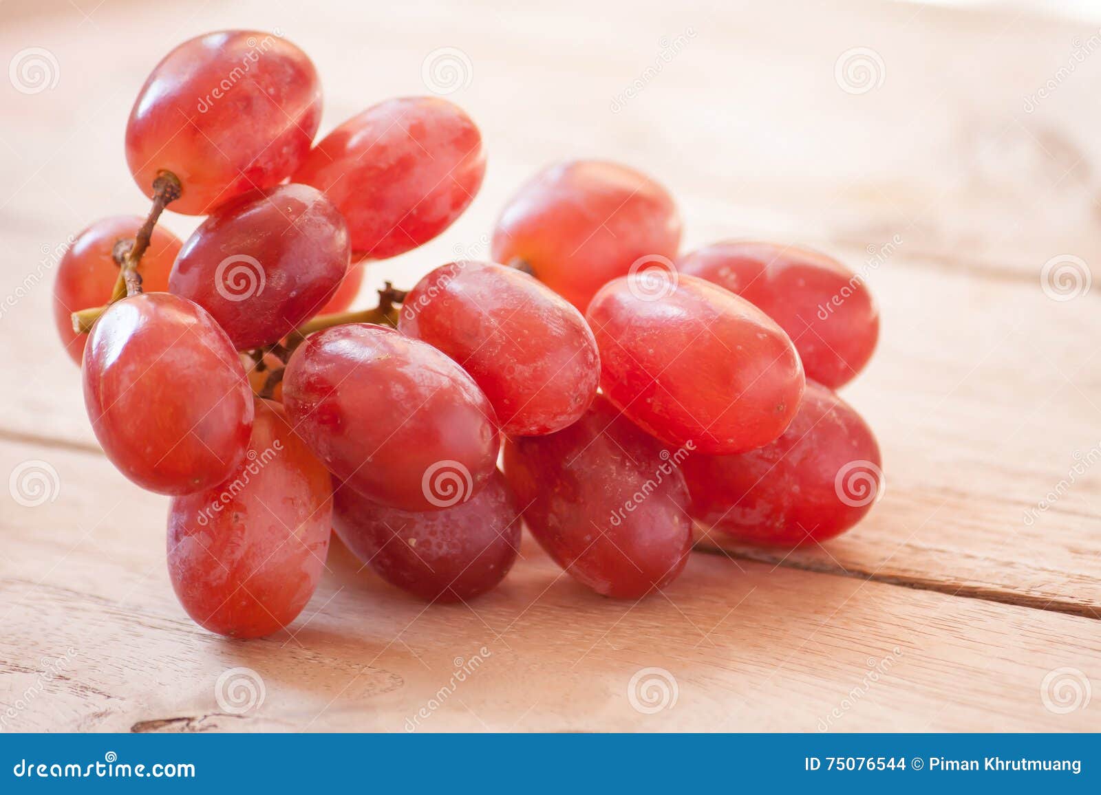 Grapes on wooden table stock photo. Image of wooden, grapes - 75076544