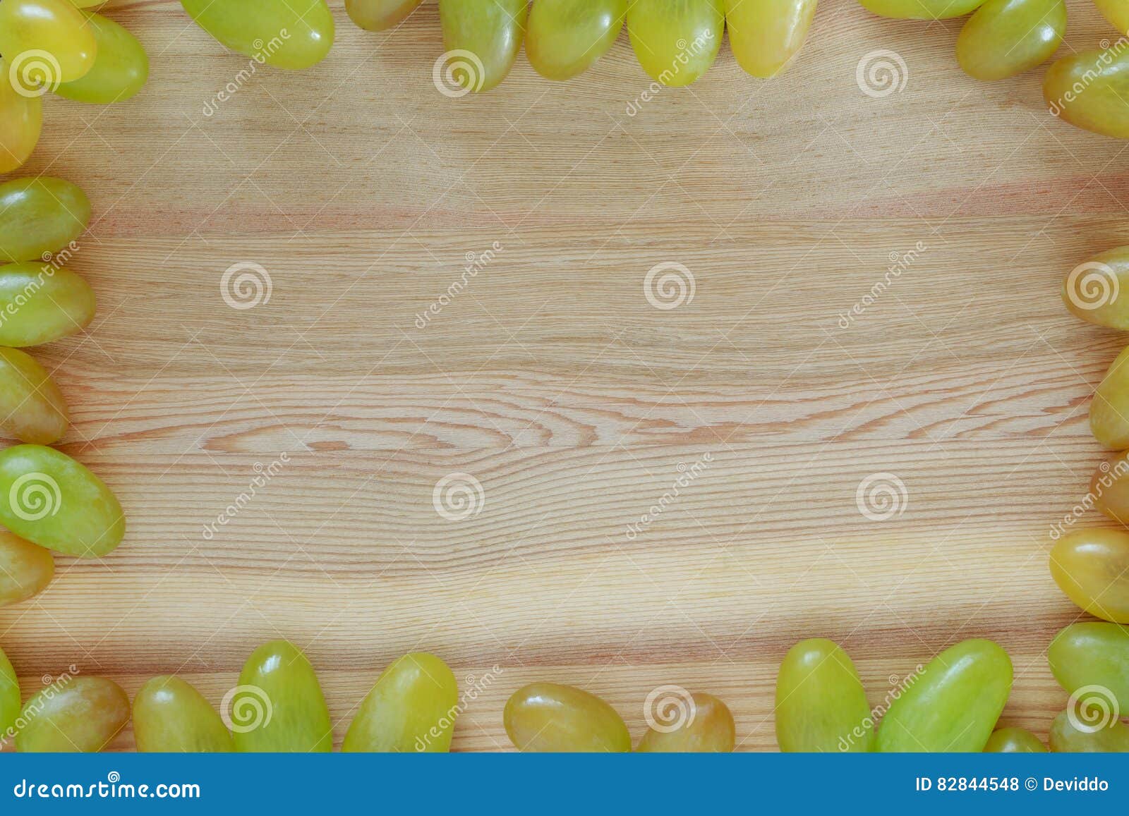 Grapes on a wooden table stock photo. Image of health - 82844548