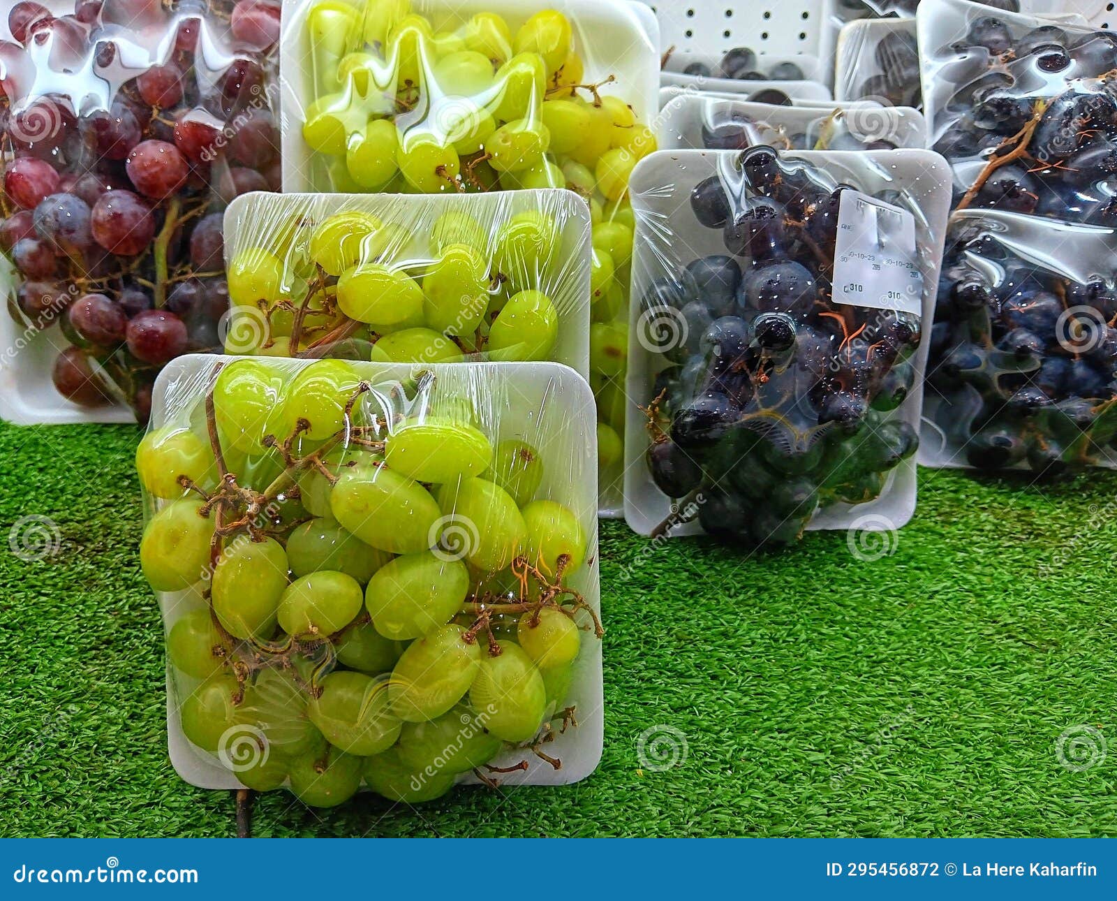 Grapes wrapped in plastic stock photo. Image of product - 295456872