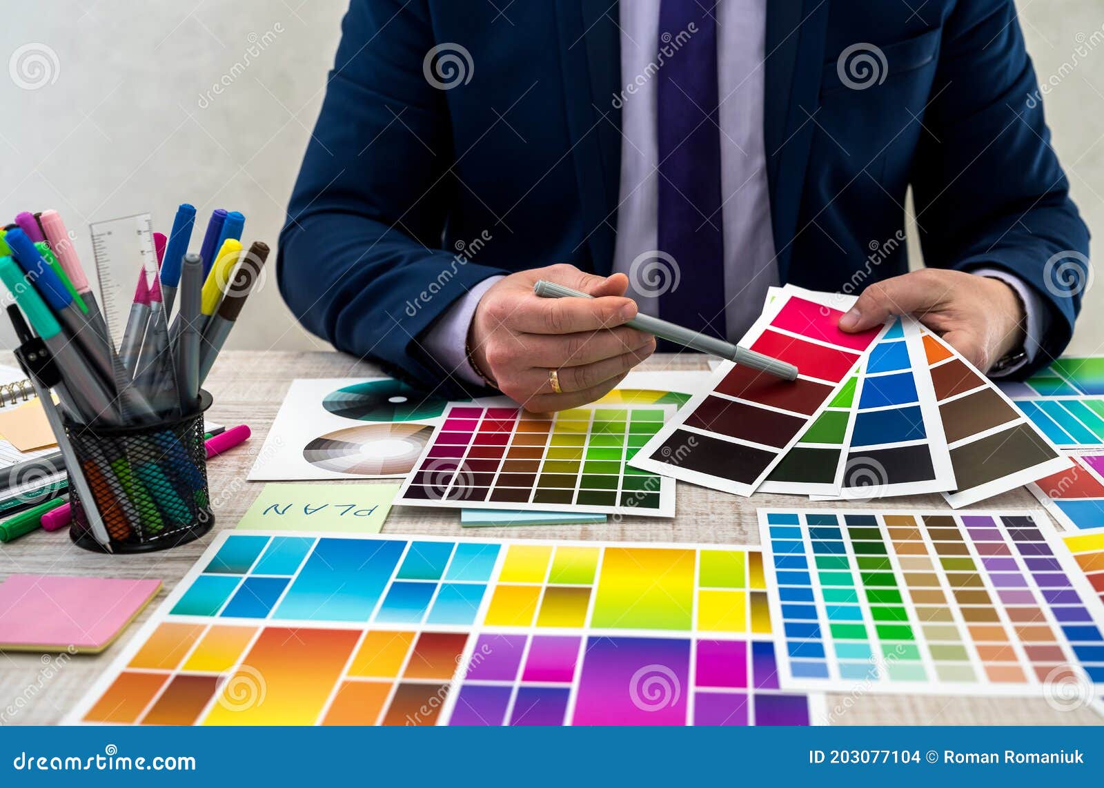 Graphic Designer Choosing a Color from a Sampler at Office. Man Hands ...
