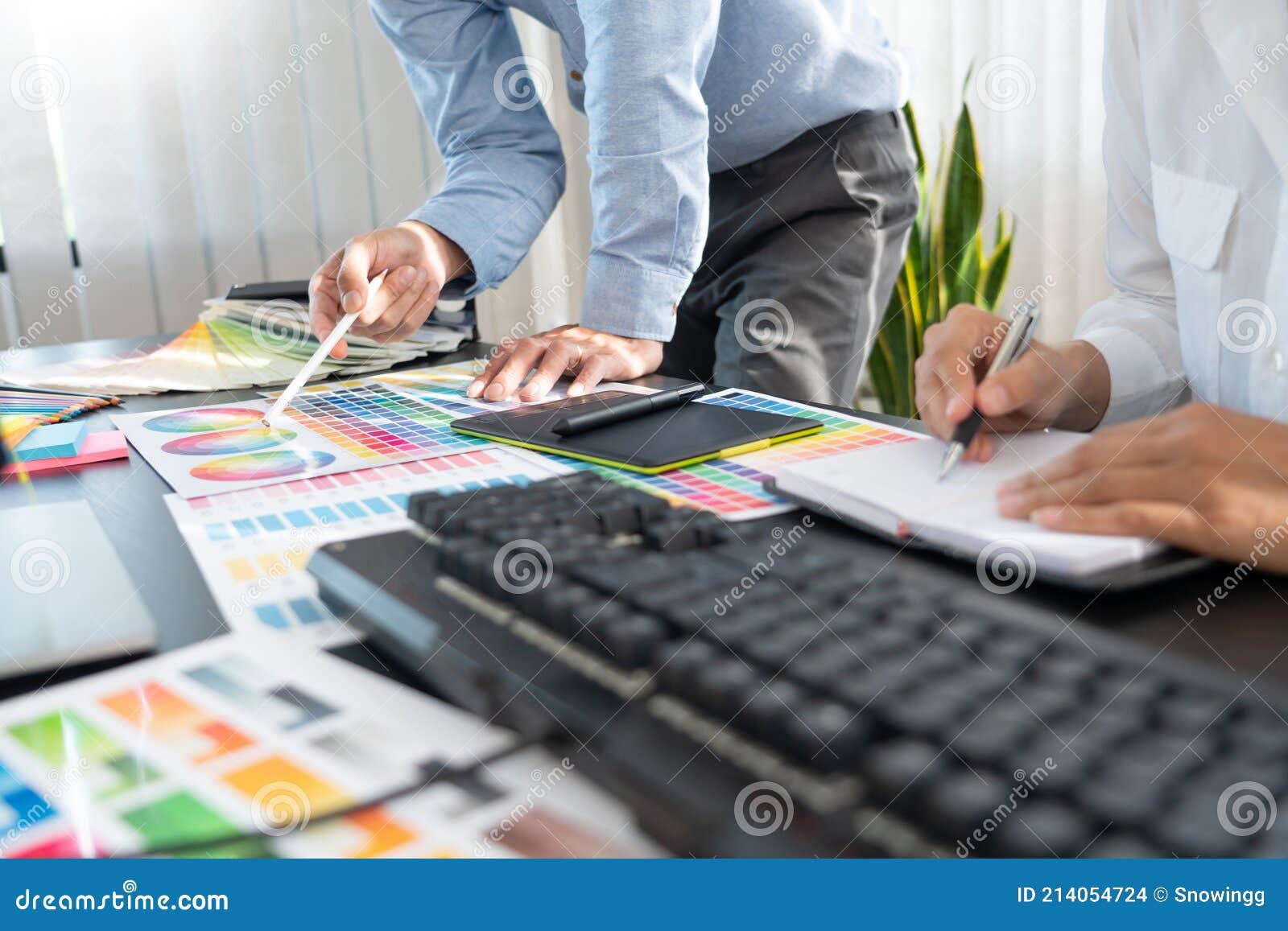 Graphic Designer or Creative Working Together Coloring Using Graphics ...