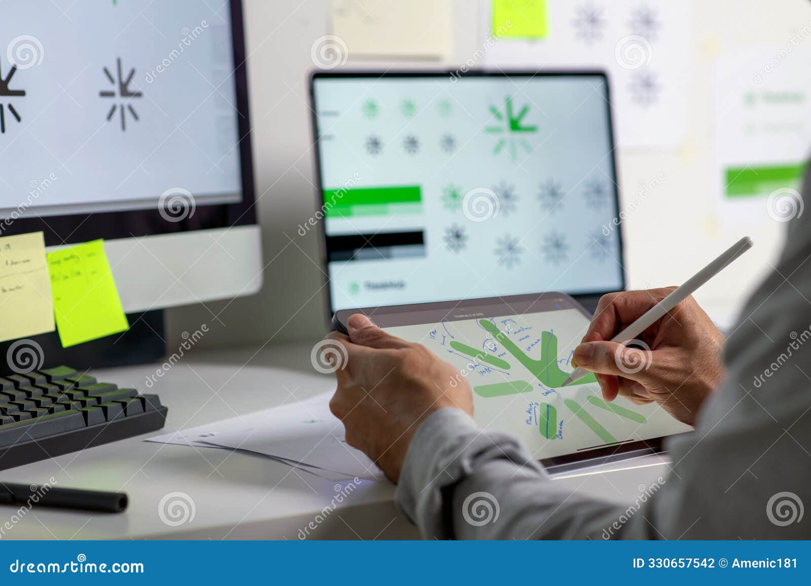 Graphic Designer Making Notes on Logo Designs, Designing Logos, and ...