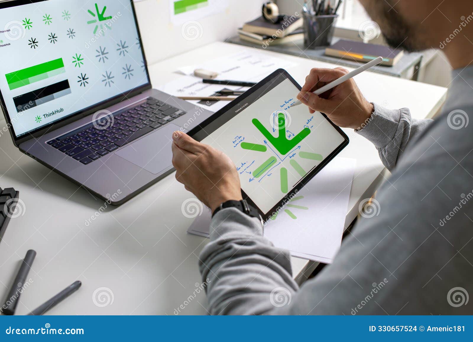 Graphic Designer Making Notes on Logo Designs, Designing Logos, and ...