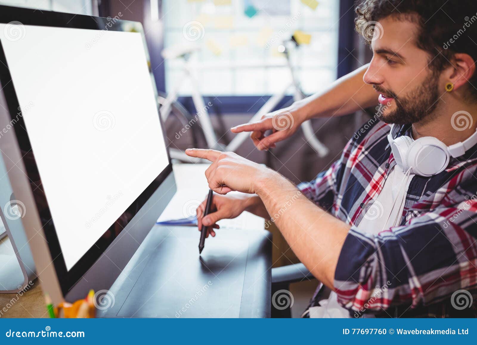 Graphic Designer Pointing at Computer Monitor in Creative Office Stock ...