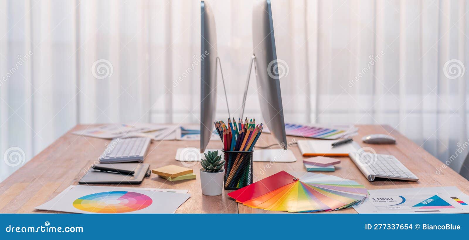 Graphic Designer& X27;s Workspace Features Color Palette and Laptop ...