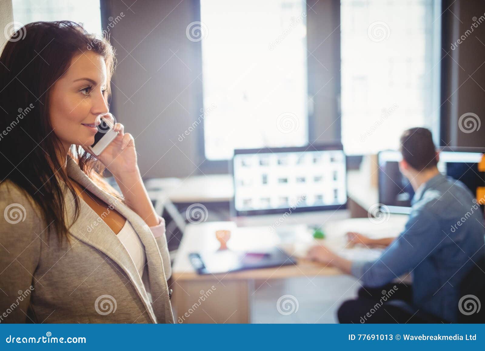 Graphic Designer Talking on Mobile Phone Stock Image - Image of ...