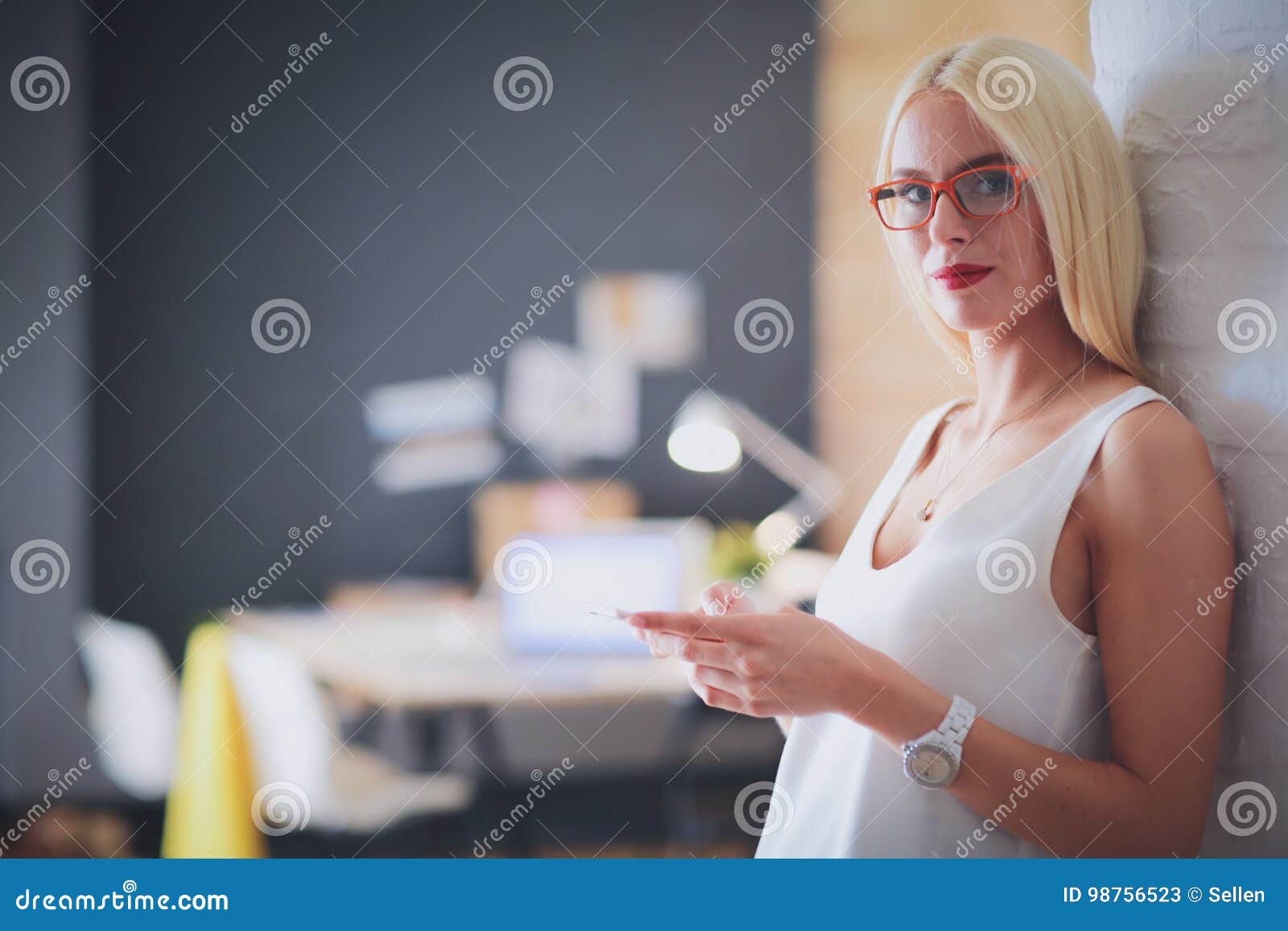 Graphic Designer Talking on Mobile Phone in Office Stock Image - Image ...
