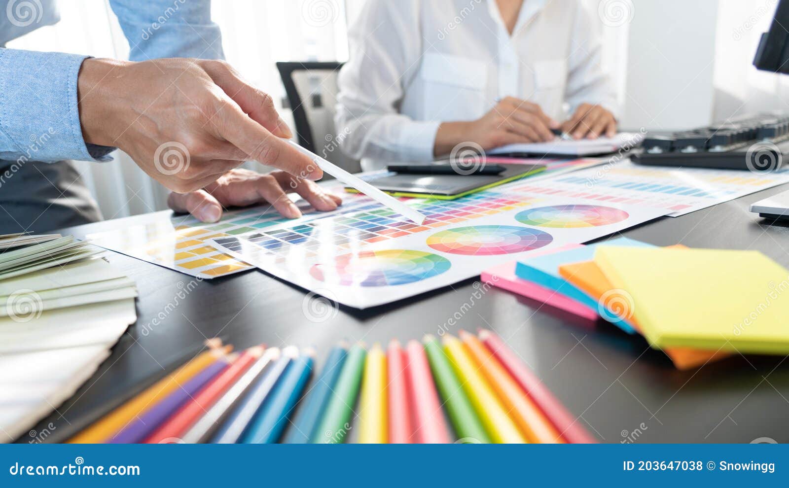 Graphic Designer Team Working on Web Design Using Color Swatches ...