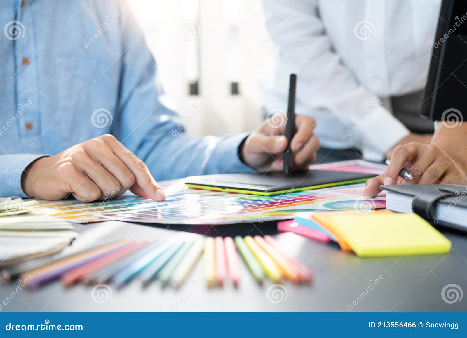 Graphic Designer Team Working on Web Design Using Color Swatches ...