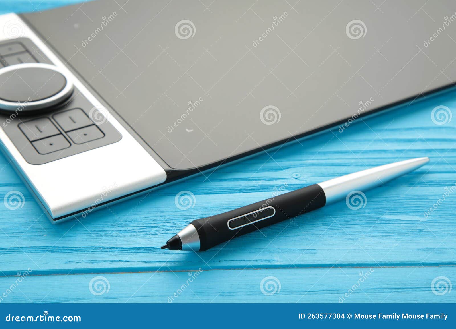Graphic Designer Using Digital Tablet on Blue Background Stock Photo ...
