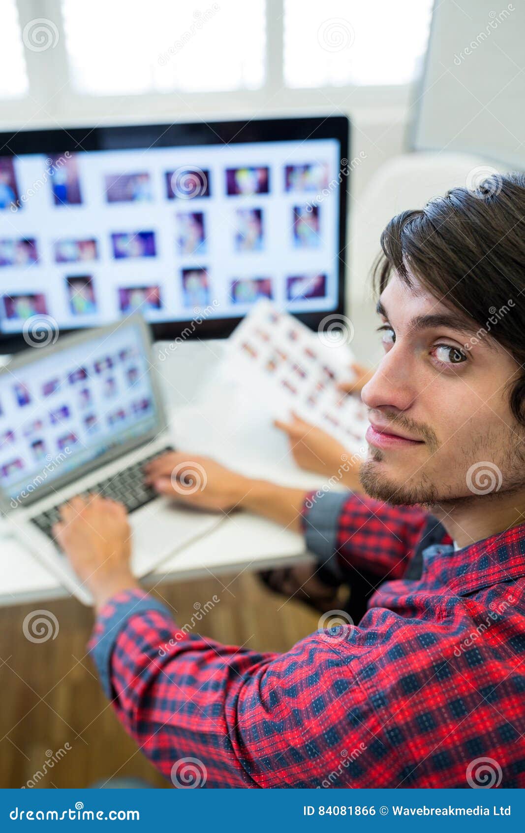 Graphic Designer Using Laptop at His Desk Stock Photo - Image of ...