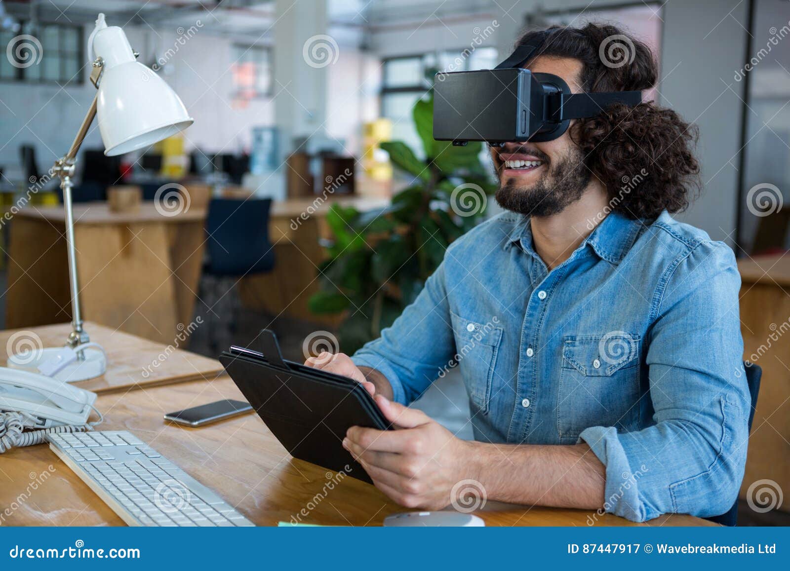 Graphic Designer Using the Virtual Reality Headset and Digital Tablet ...