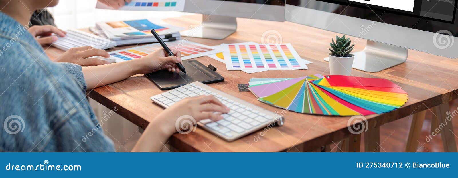 Graphic Designer Works on Computer Laptop with Digital Pen. Scrutinize ...