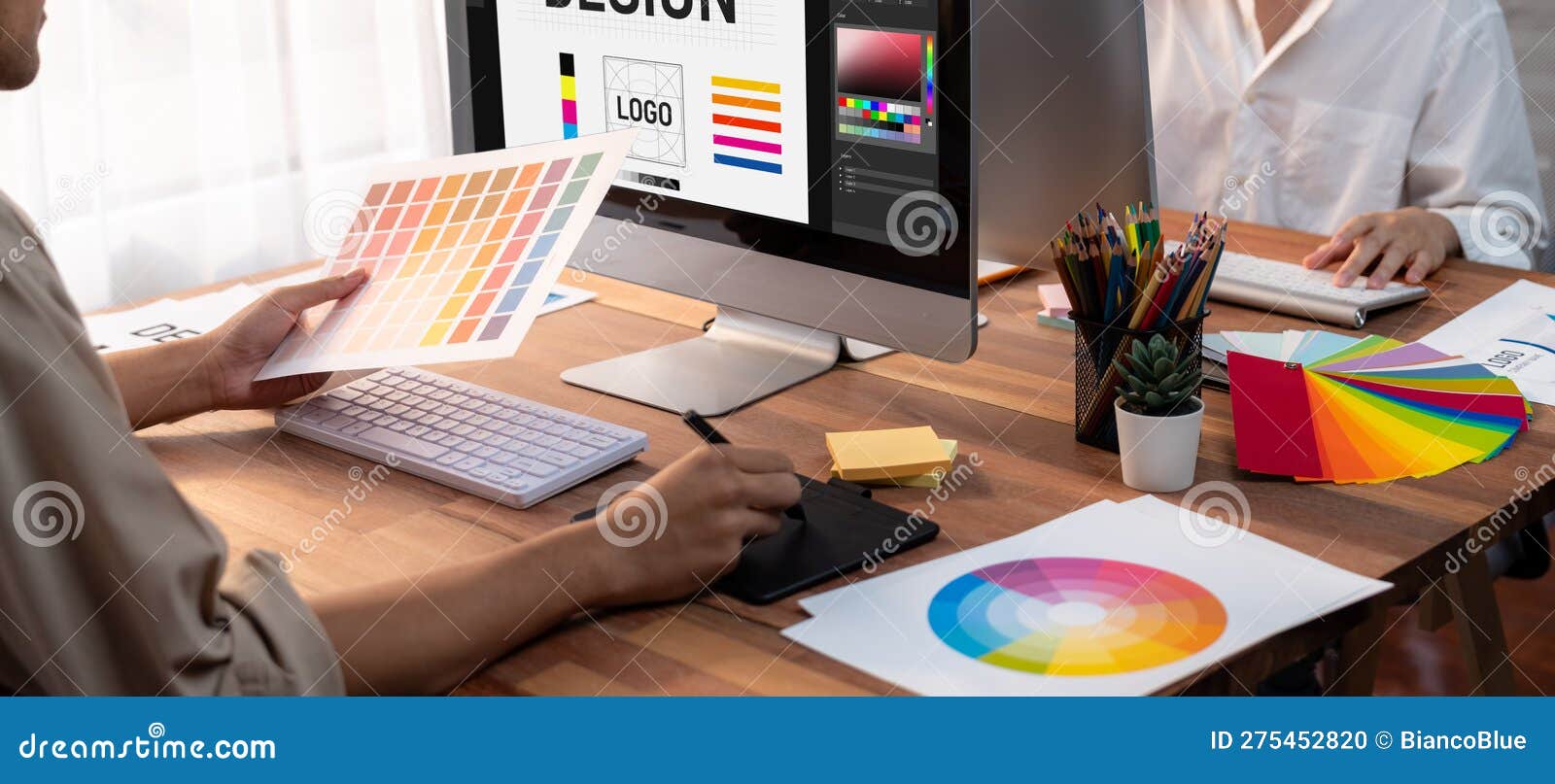 Graphic Designer Works on Computer Laptop with Digital Pen. Scrutinize ...