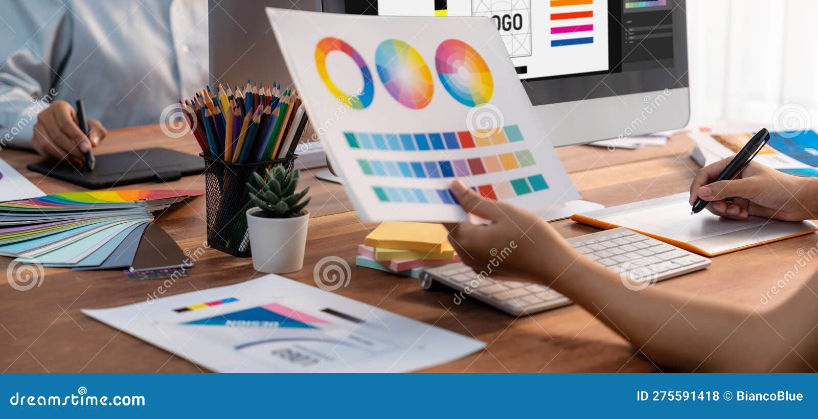 Graphic Designer Works on Computer Laptop with Digital Pen. Scrutinize ...