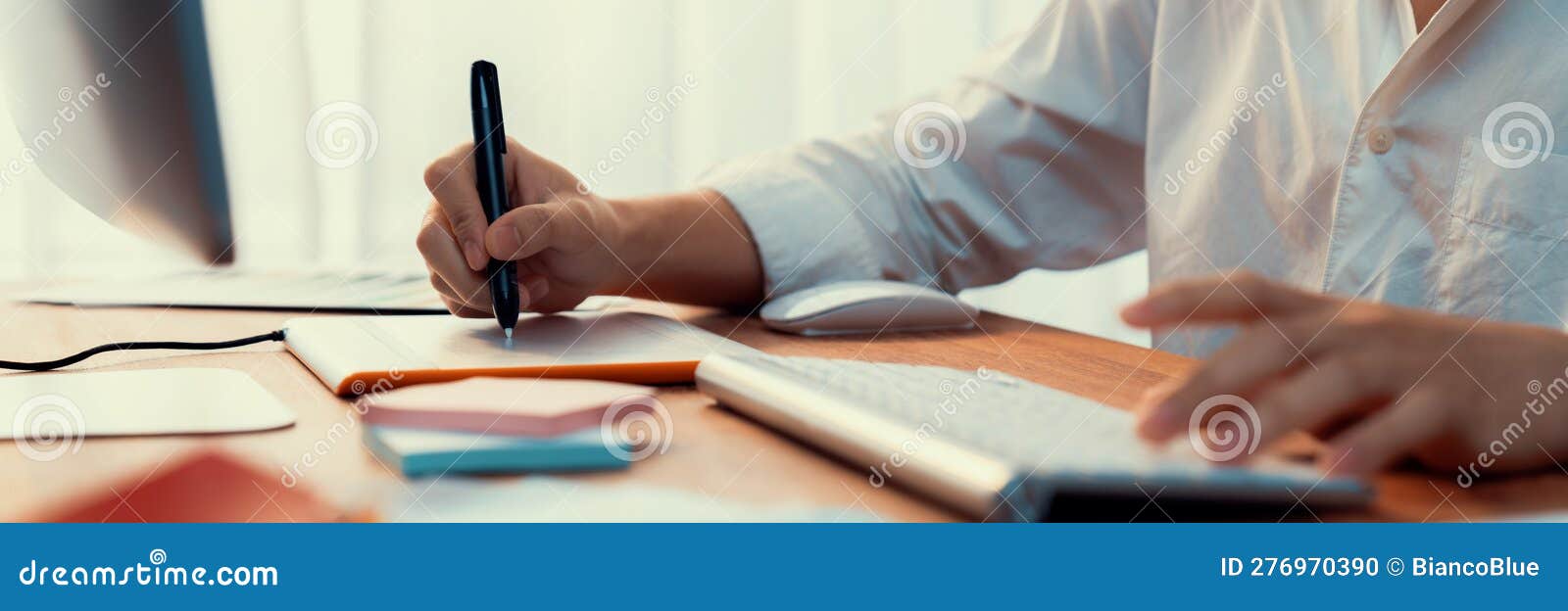 Graphic Designer Works on Computer Laptop with Digital Pen. Scrutinize ...