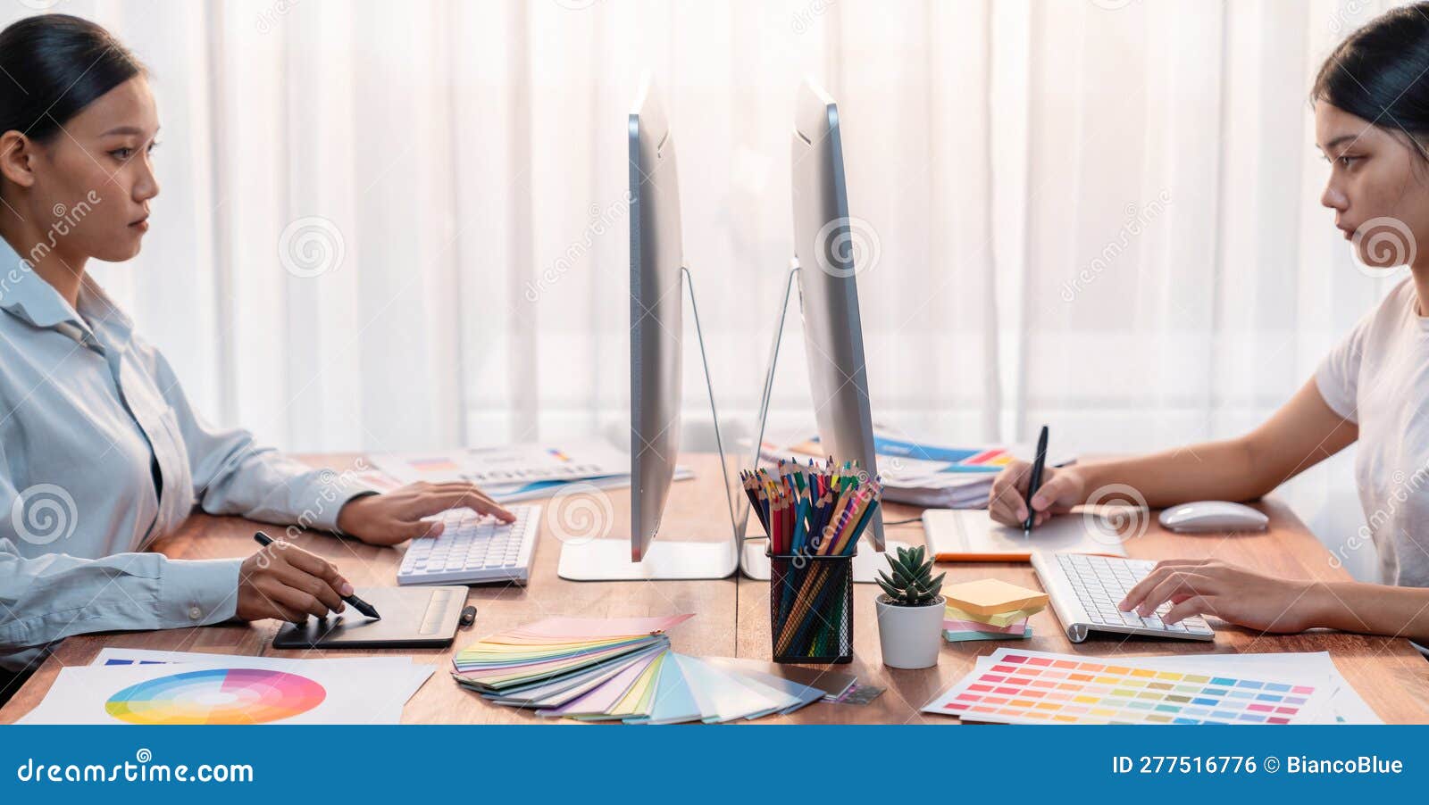 Graphic Designer Works on Computer Laptop with Digital Pen. Scrutinize ...
