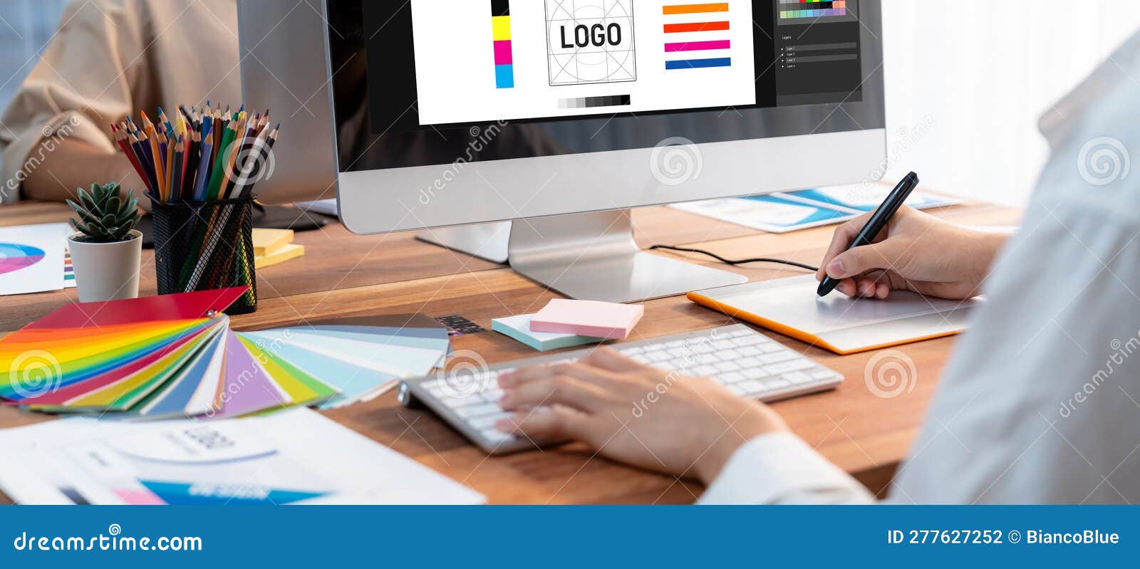 Graphic Designer Works on Computer Laptop with Digital Pen. Scrutinize ...