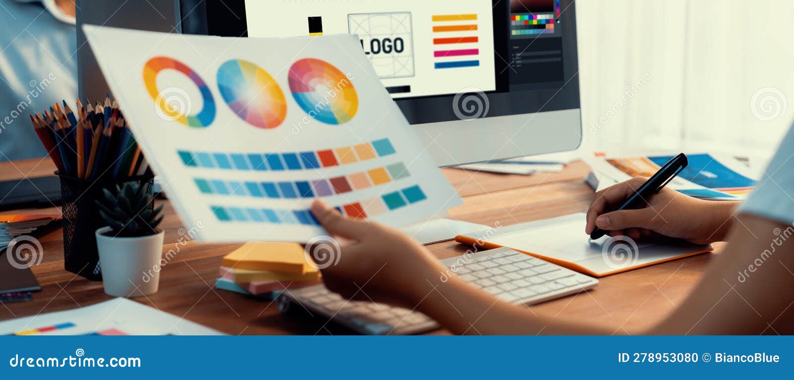 Graphic Designer Works on Computer Laptop with Digital Pen. Scrutinize ...