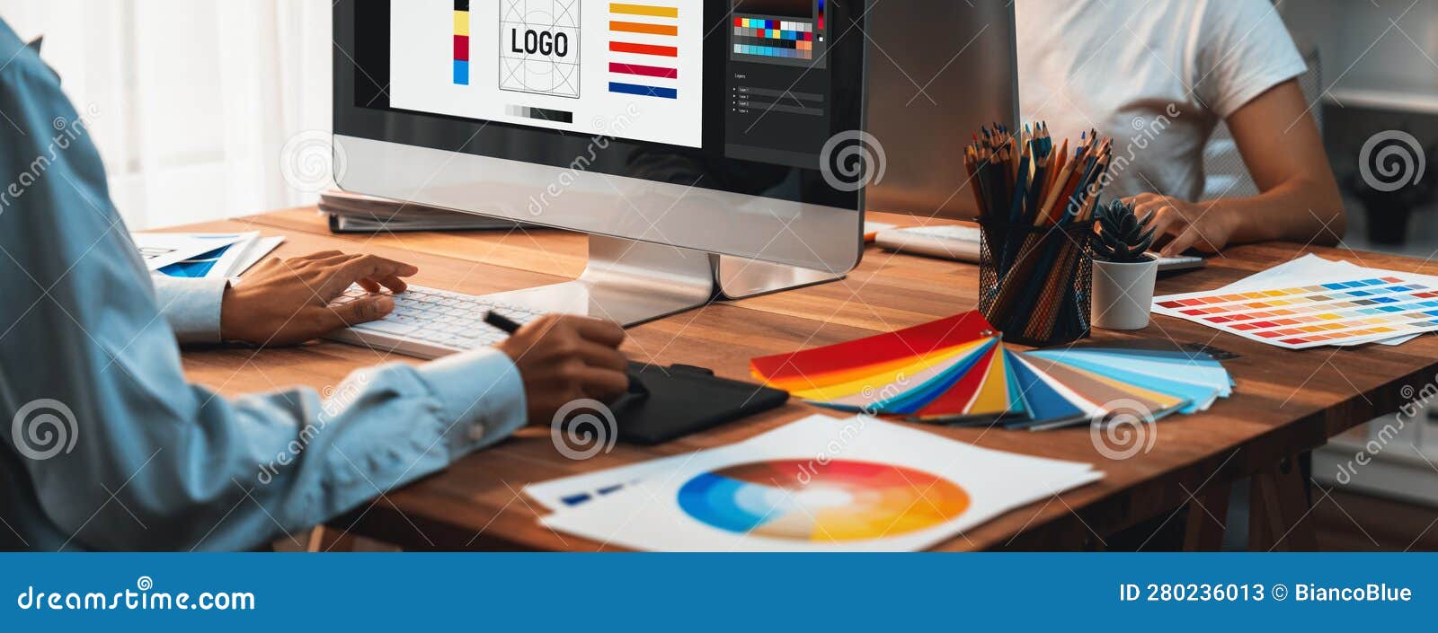 Graphic Designer Works on Computer Laptop with Digital Pen. Scrutinize ...