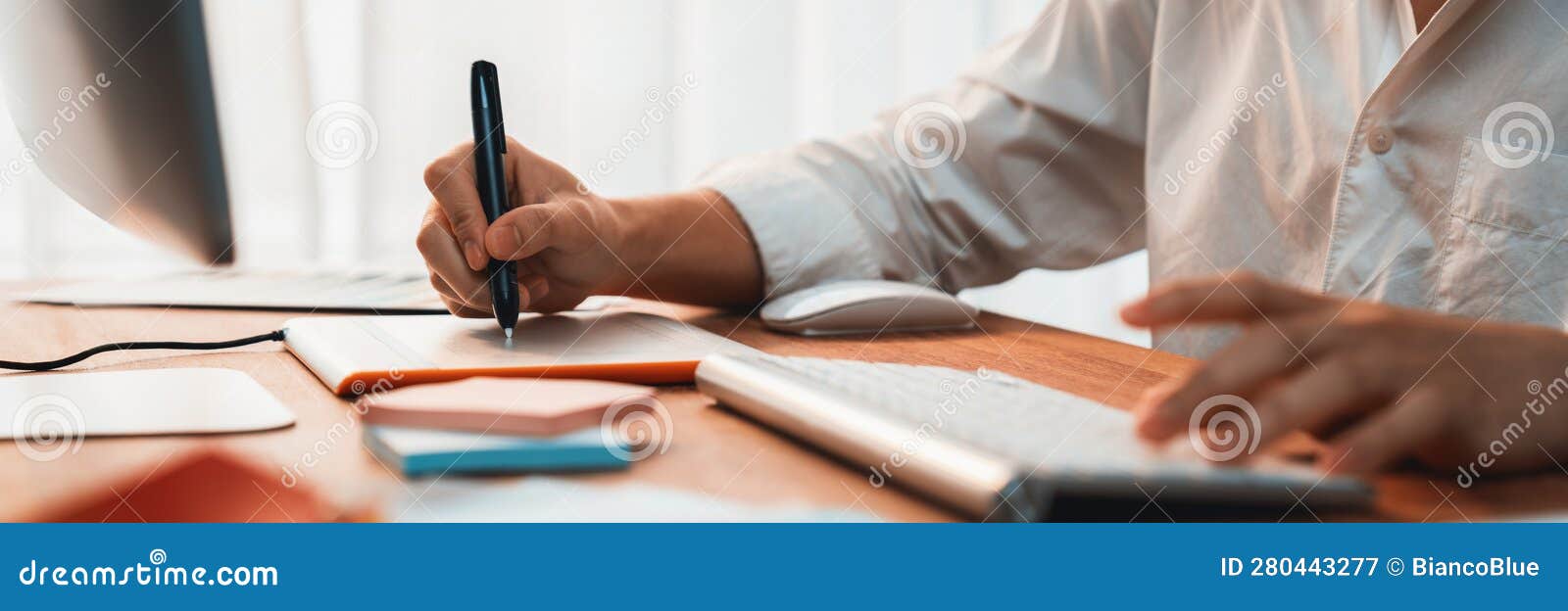 Graphic Designer Works on Computer Laptop with Digital Pen. Scrutinize ...