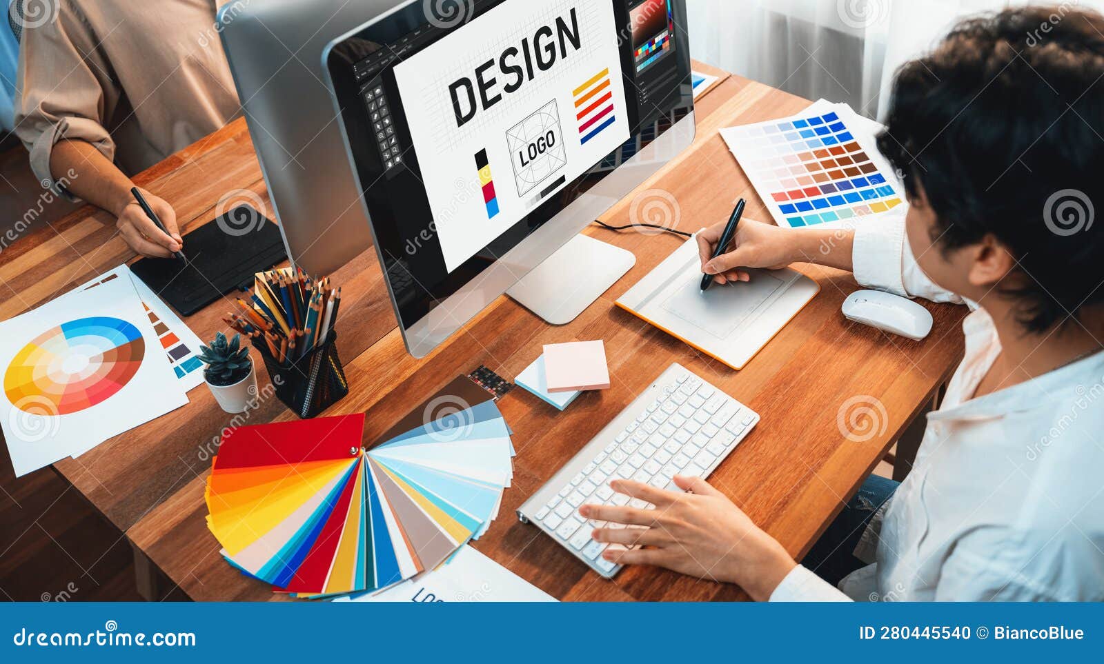 Graphic Designer Works on Computer Laptop with Digital Pen. Scrutinize ...