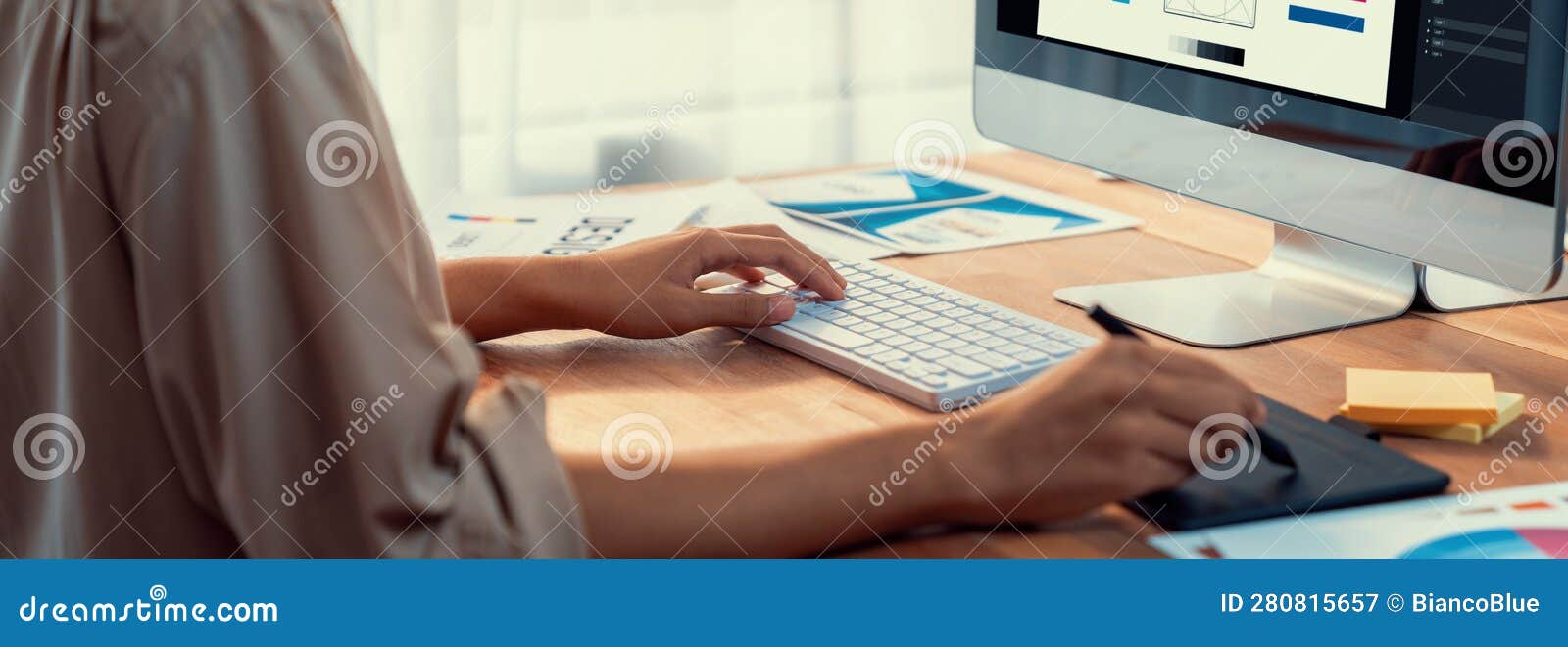 Graphic Designer Works on Computer Laptop with Digital Pen. Scrutinize ...