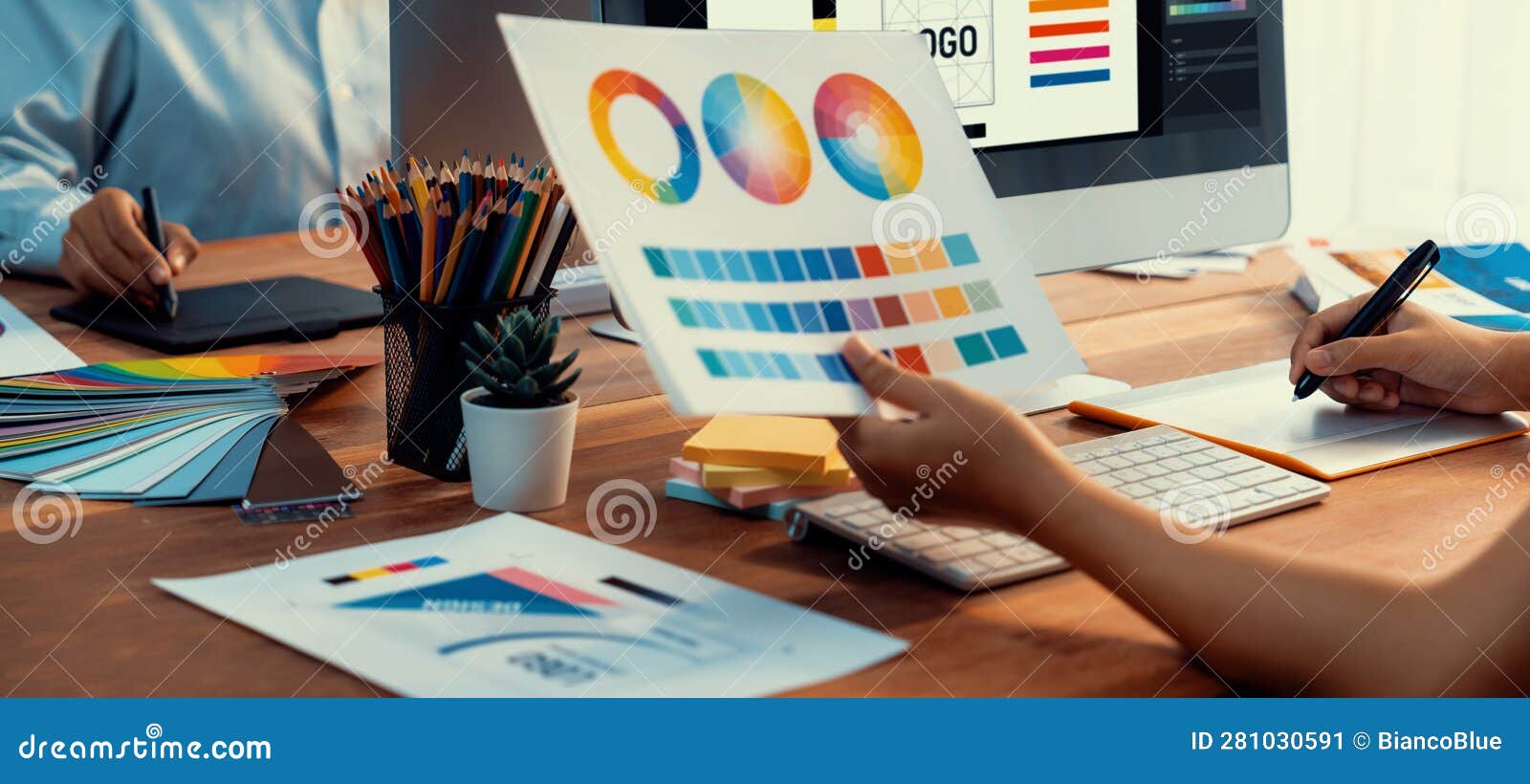 Graphic Designer Works on Computer Laptop with Digital Pen. Scrutinize ...