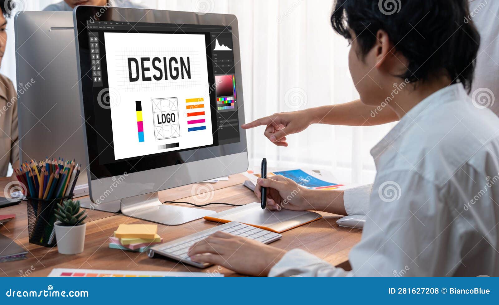 Graphic Designer Works on Computer Laptop with Digital Pen. Scrutinize ...