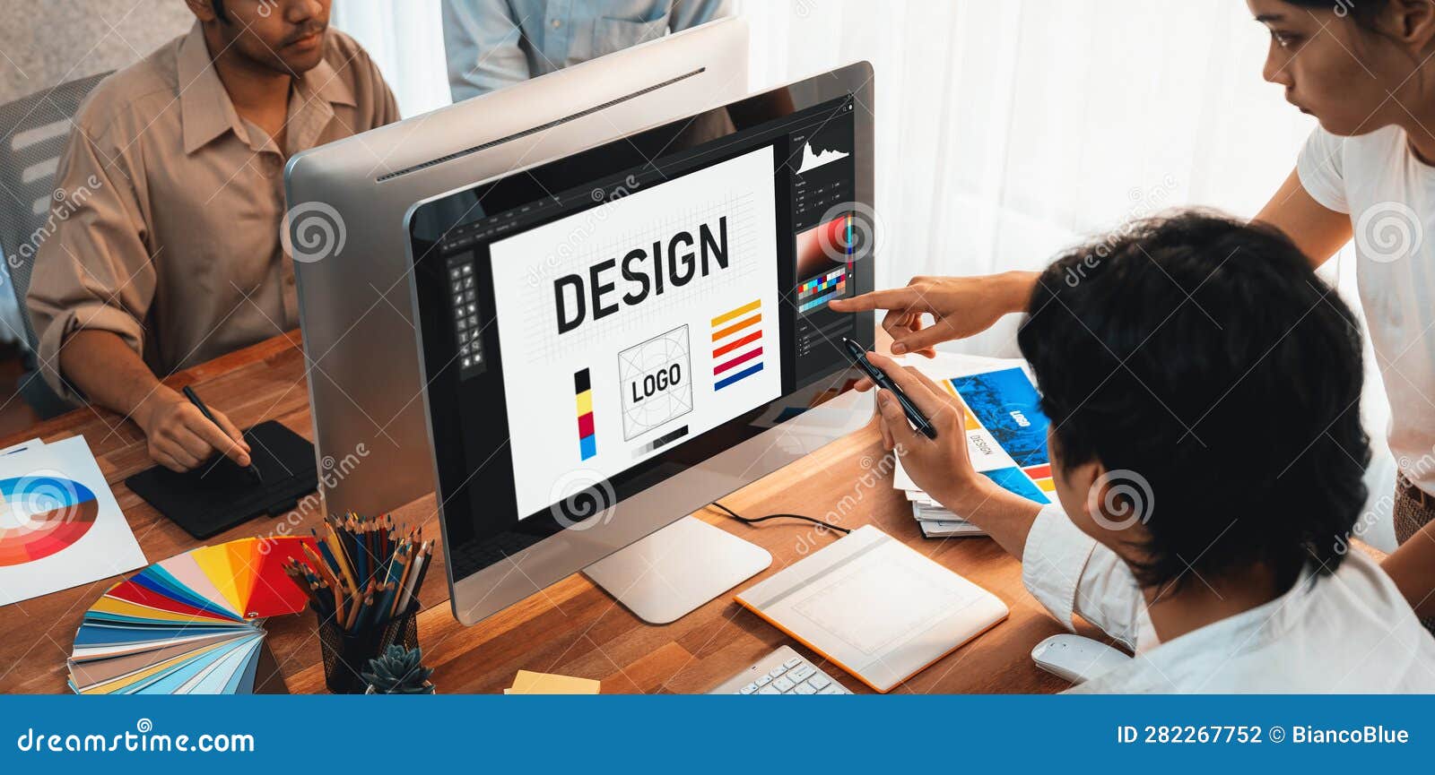 Graphic Designer Works on Computer Laptop with Digital Pen. Scrutinize ...