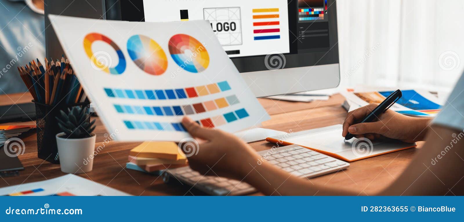 Graphic Designer Works on Computer Laptop with Digital Pen. Scrutinize ...