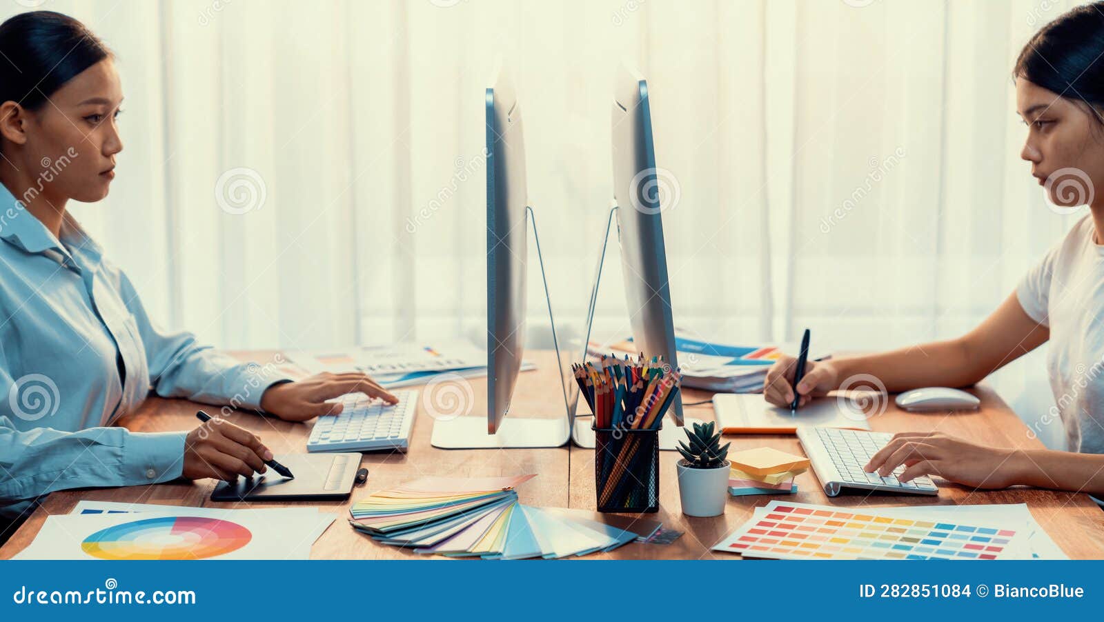 Graphic Designer Works on Computer Laptop with Digital Pen. Scrutinize ...