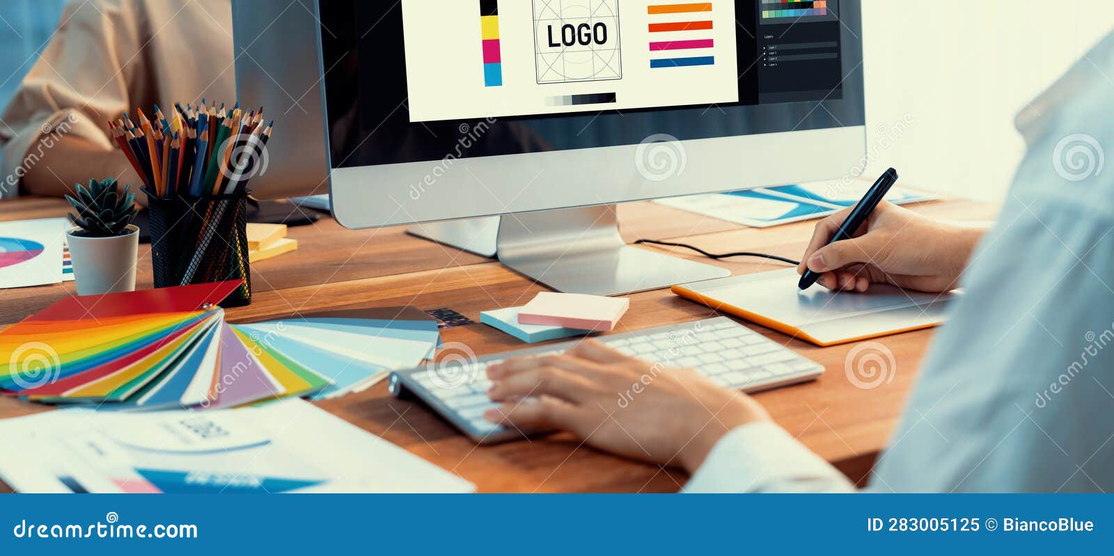 Graphic Designer Works on Computer Laptop with Digital Pen. Scrutinize ...