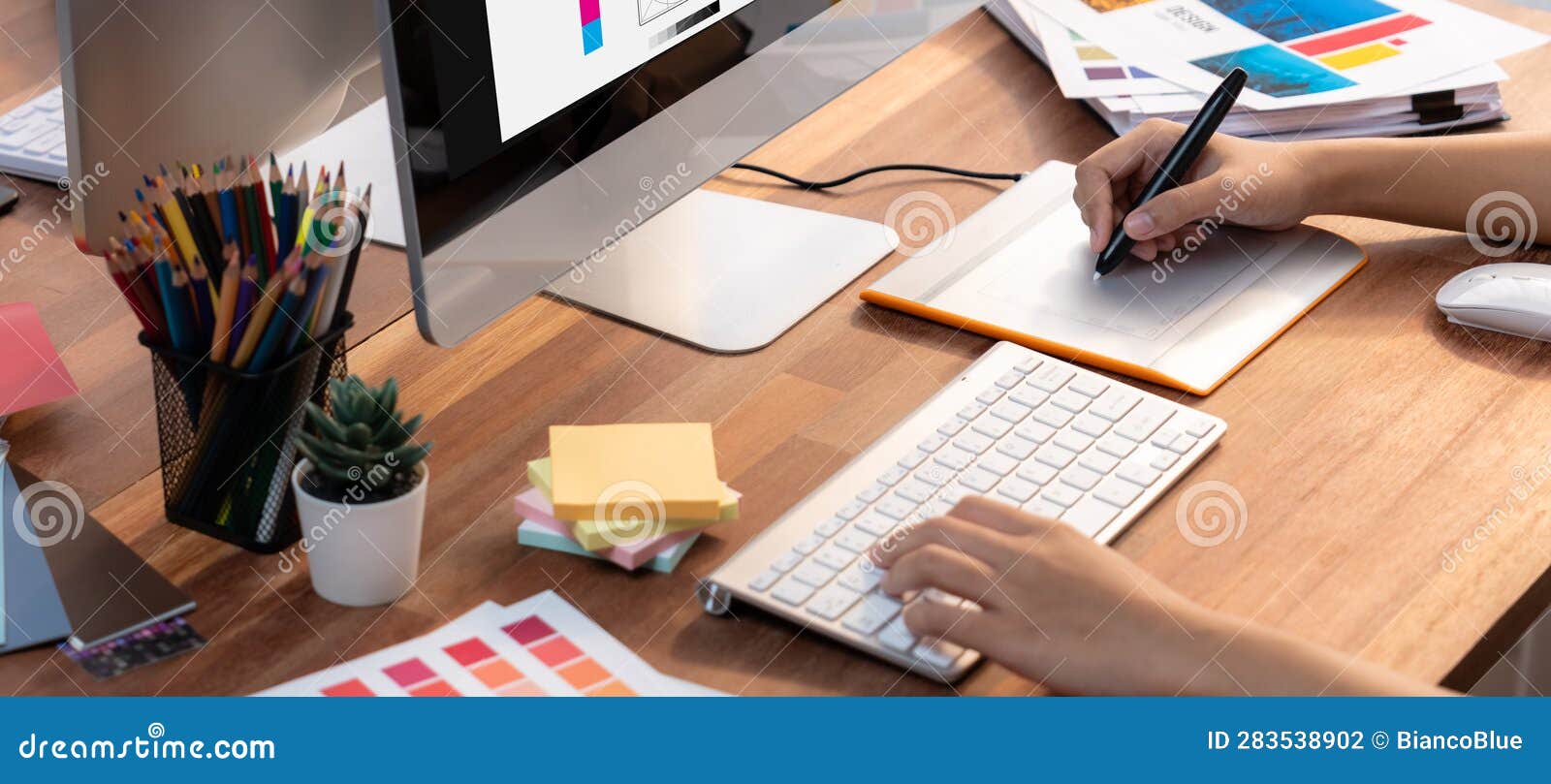 Graphic Designer Works on Computer Laptop with Digital Pen. Scrutinize ...