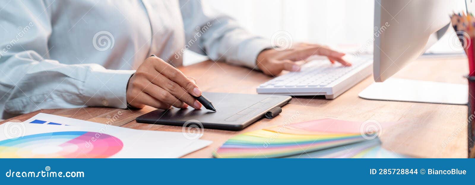 Graphic Designer Works on Computer Laptop with Digital Pen. Scrutinize ...